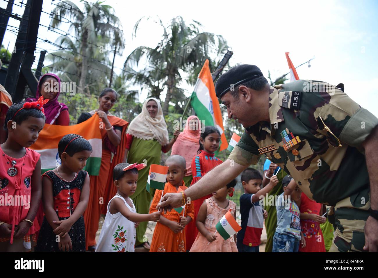 BSF (Border Security Force) officials distributes Indian flag to ...