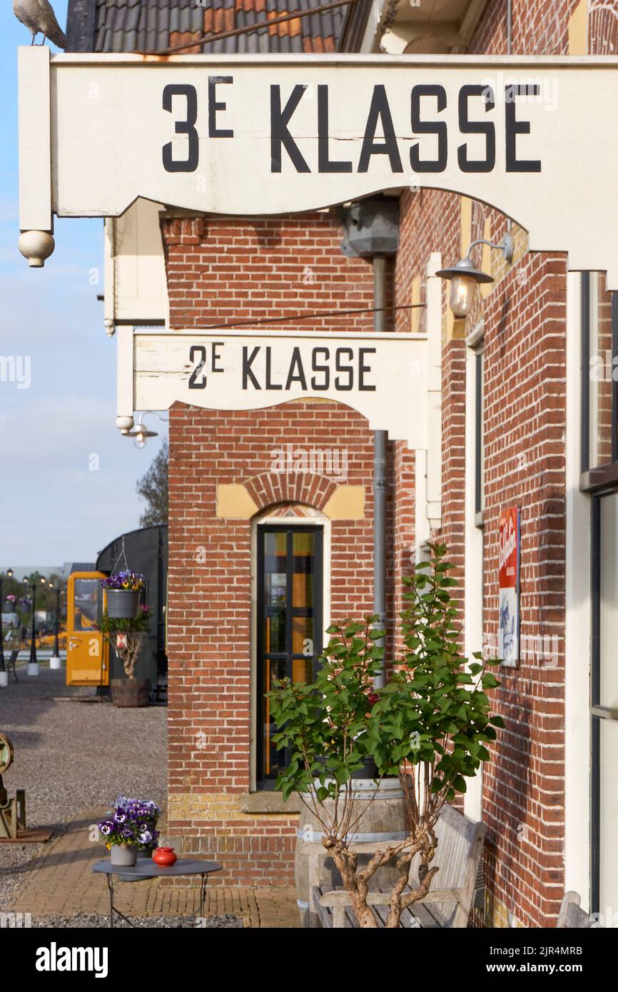 Third and second class signs in dutch language on an old train station ...
