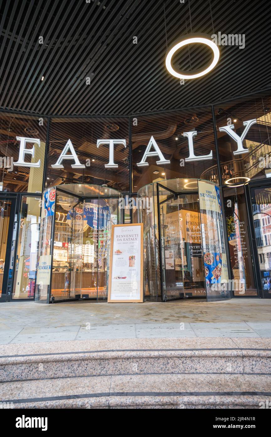 Main entrance and brightly lit interior to Eataly Italian restaurants ...