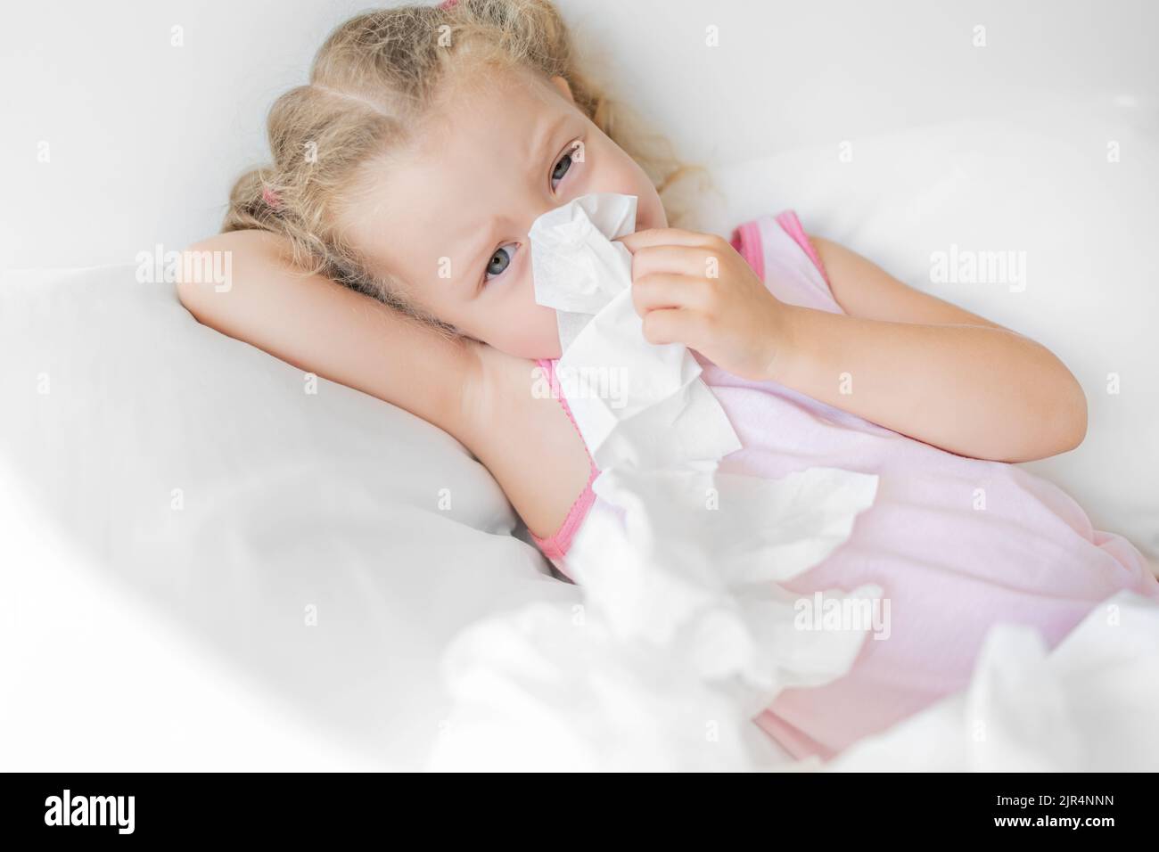The child wipes his nose with a napkin Stock Photo - Alamy