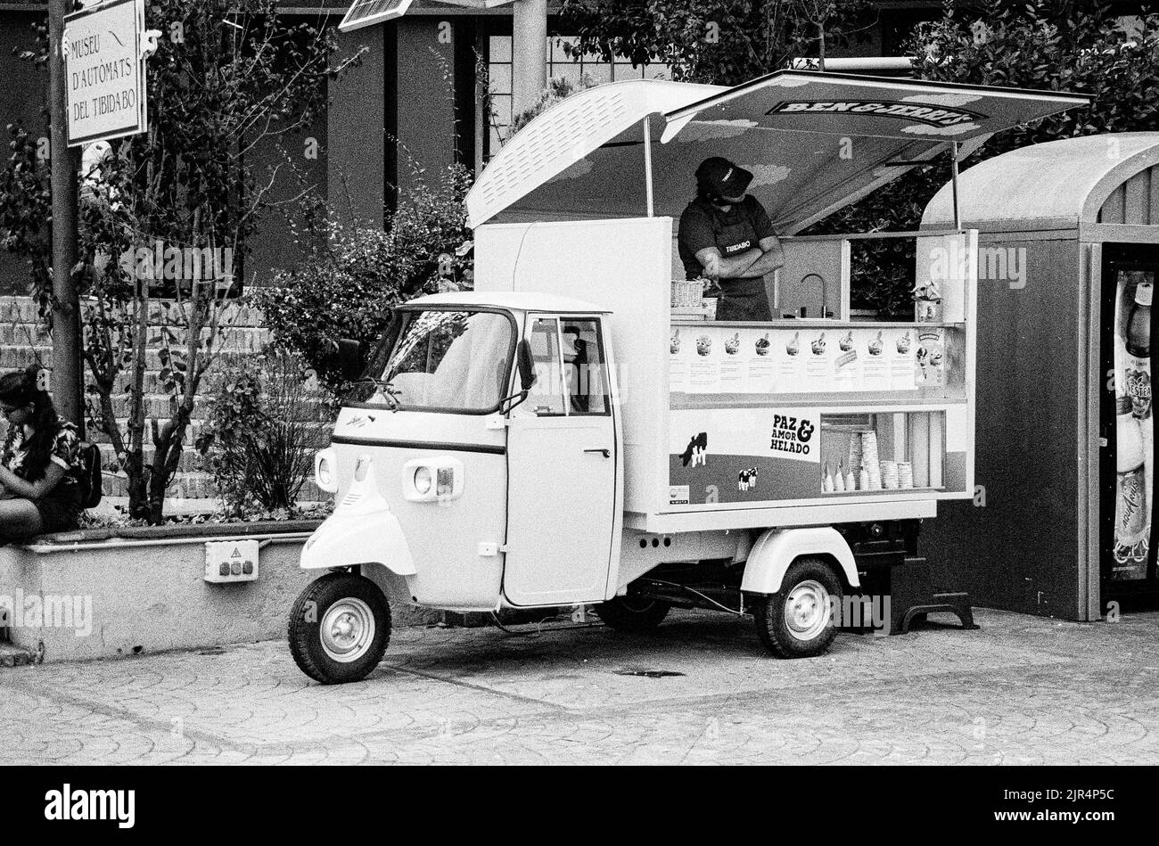A grayscale of an ice cream spot in minivan Piaggio Porter utility ...