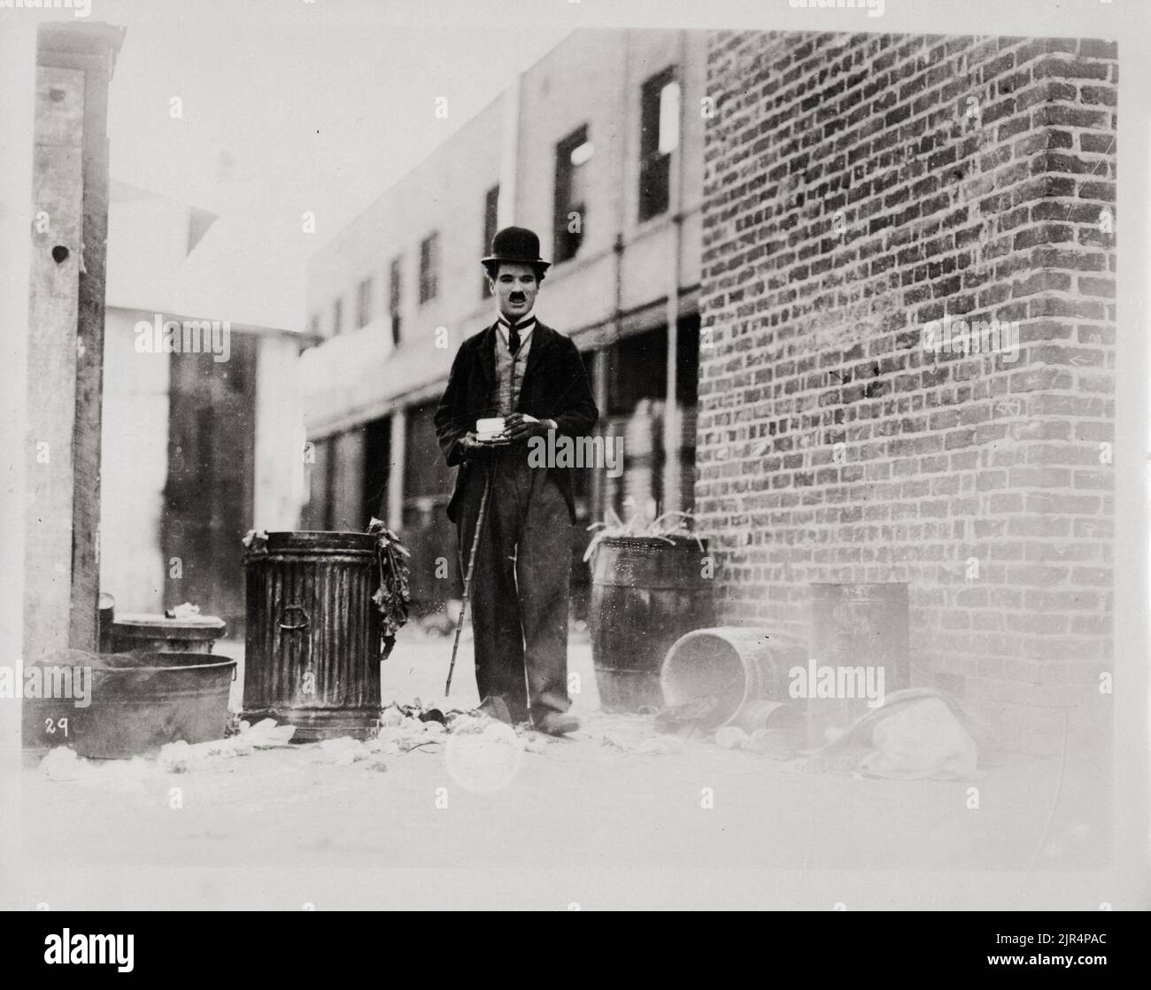 Charlie Chaplin in "The Kid" (First National, 1920s) movie scene Stock ...