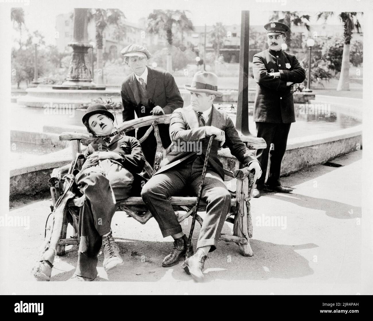 Charlie Chaplin in "The Kid" (First National, 1920s) film scene Stock ...