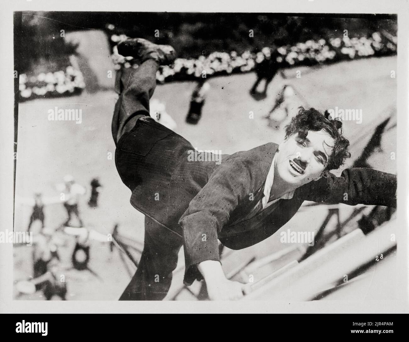 Charlie Chaplin in "The Kid" (First National, 1920s) film scene Stock ...