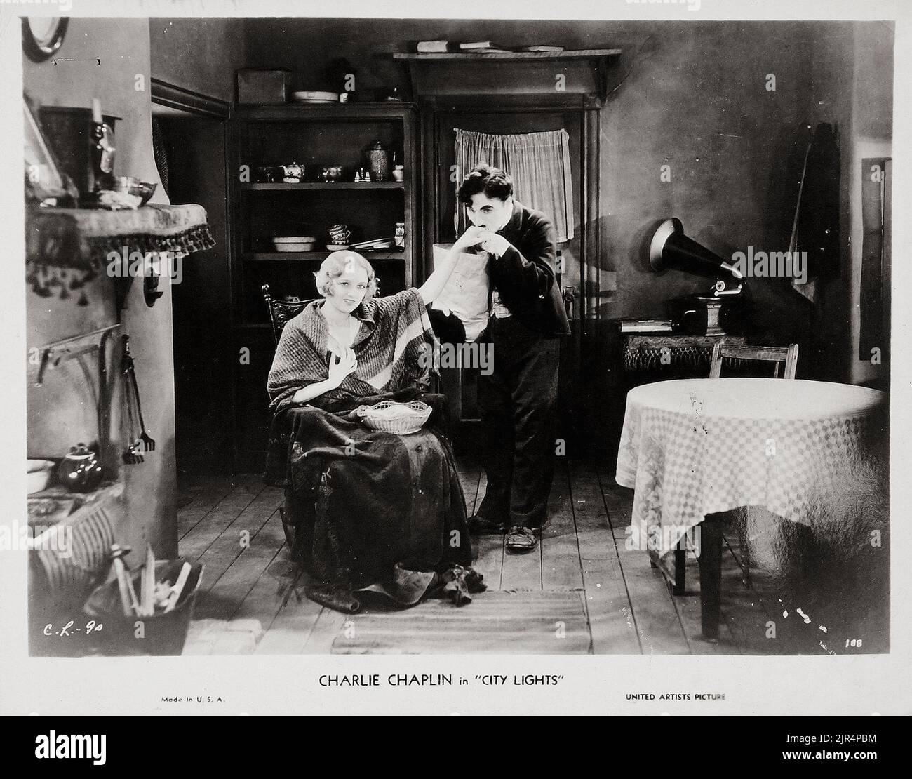 Charlie Chaplin in City Lights (United Artists, 1931). Photo from movie ...