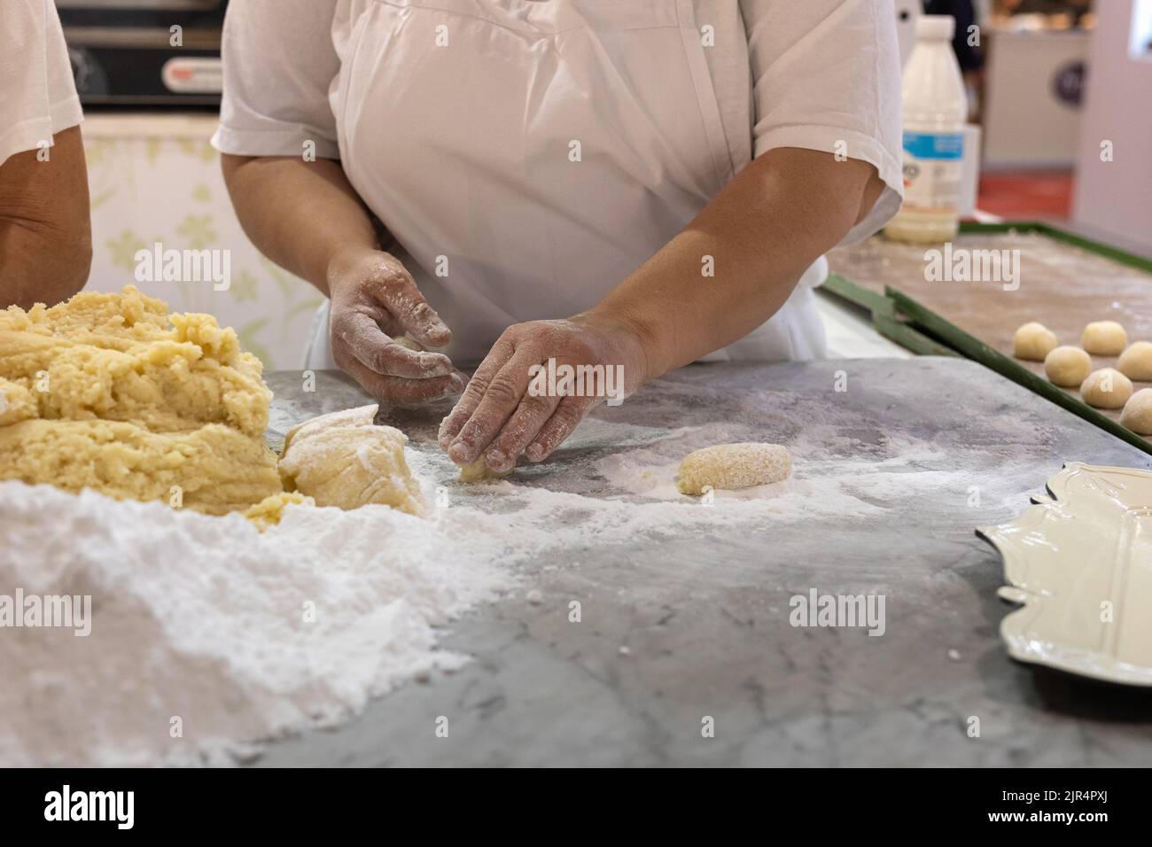 Working with Hands of Uncooked Dough with Flour and Eggs for Making ...