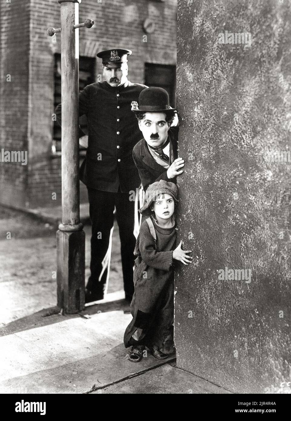 Charlie Chaplin - The Kid - withe Jackie Coogan - movie scene Stock ...
