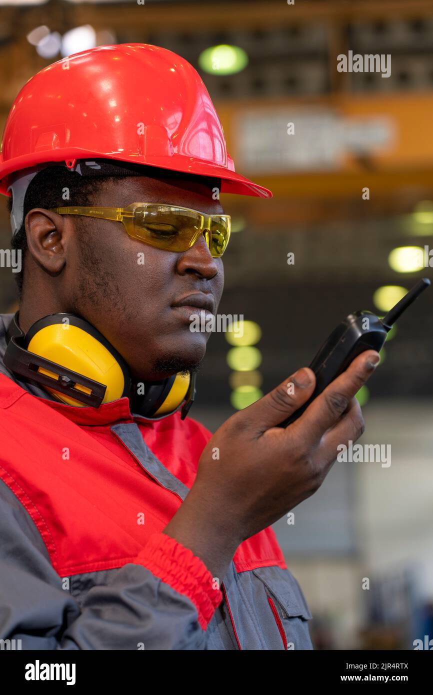 Portrait Of Black Industrial Worker In Red Helmet, Yellow Safety ...