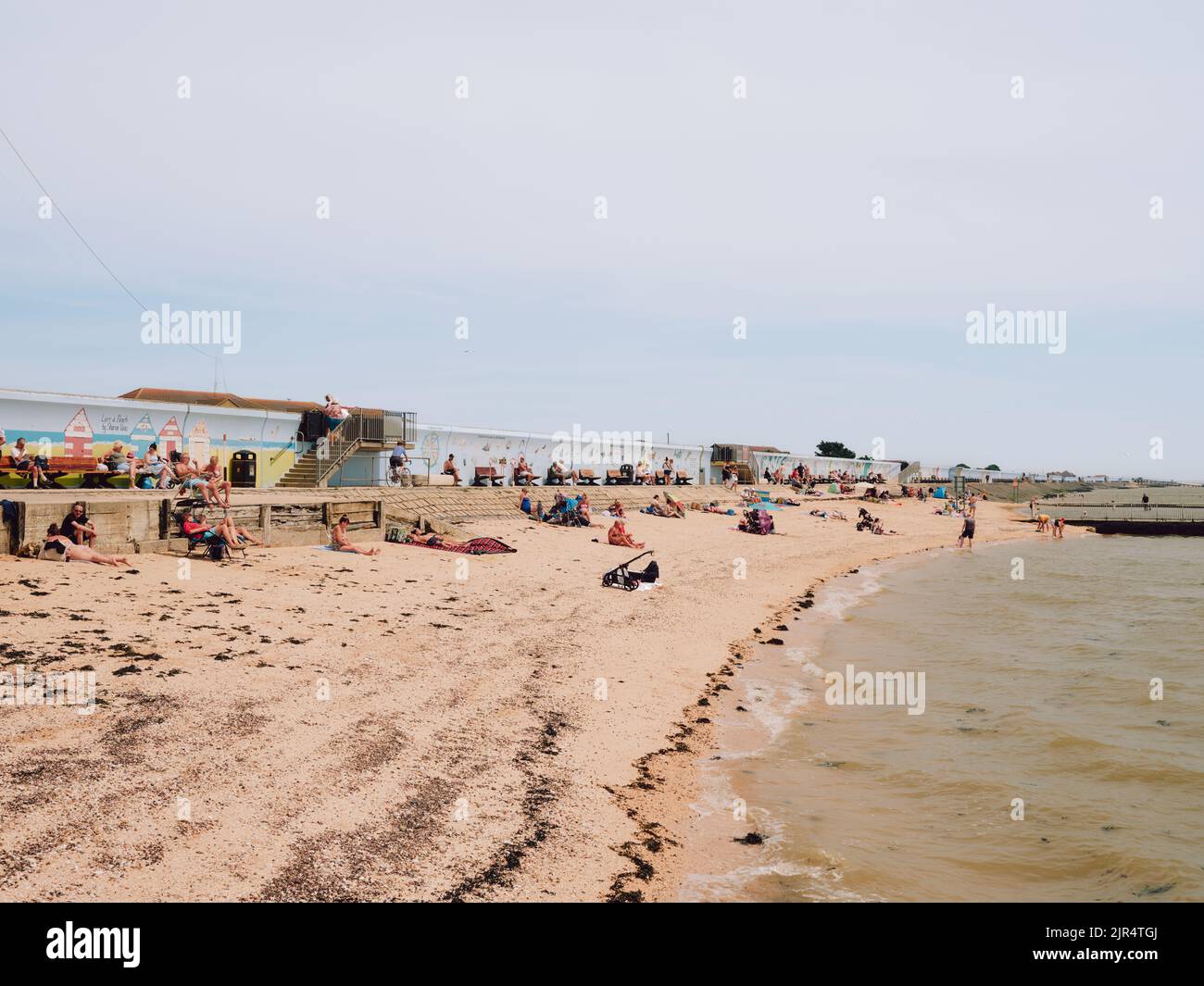 The popular small sandy Concord beach with tourists in the summer at ...