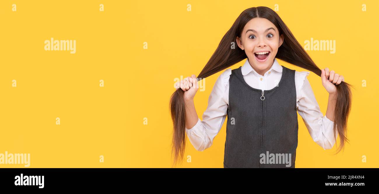 Tangle free haircare. Surprised kid hold long hair. Child face ...