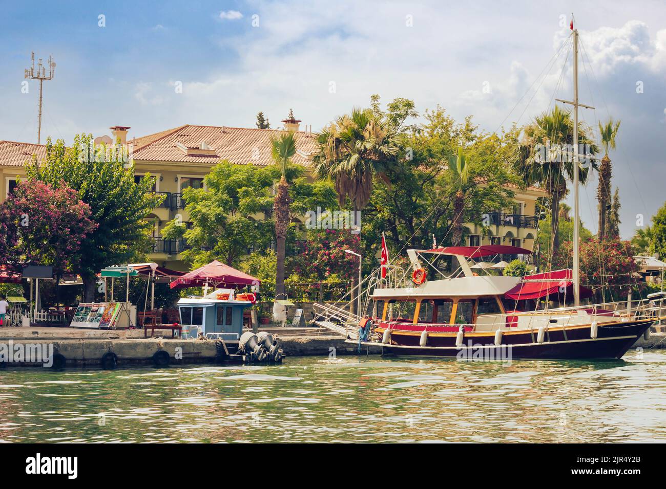 Touristic River Boats moored at the pier of the Dalyan River, Mugla, Turkey. Travel destination ...
