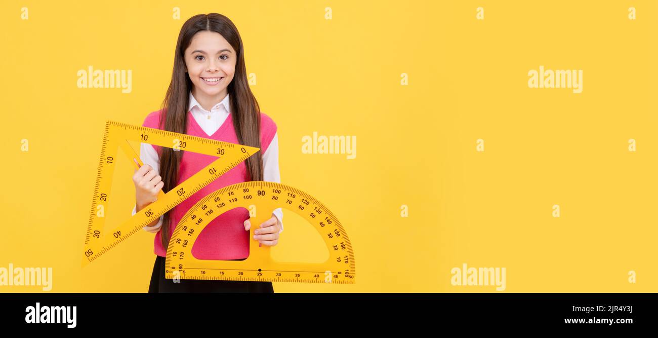cheerful teen girl study math with protractor and triangle measuring ...
