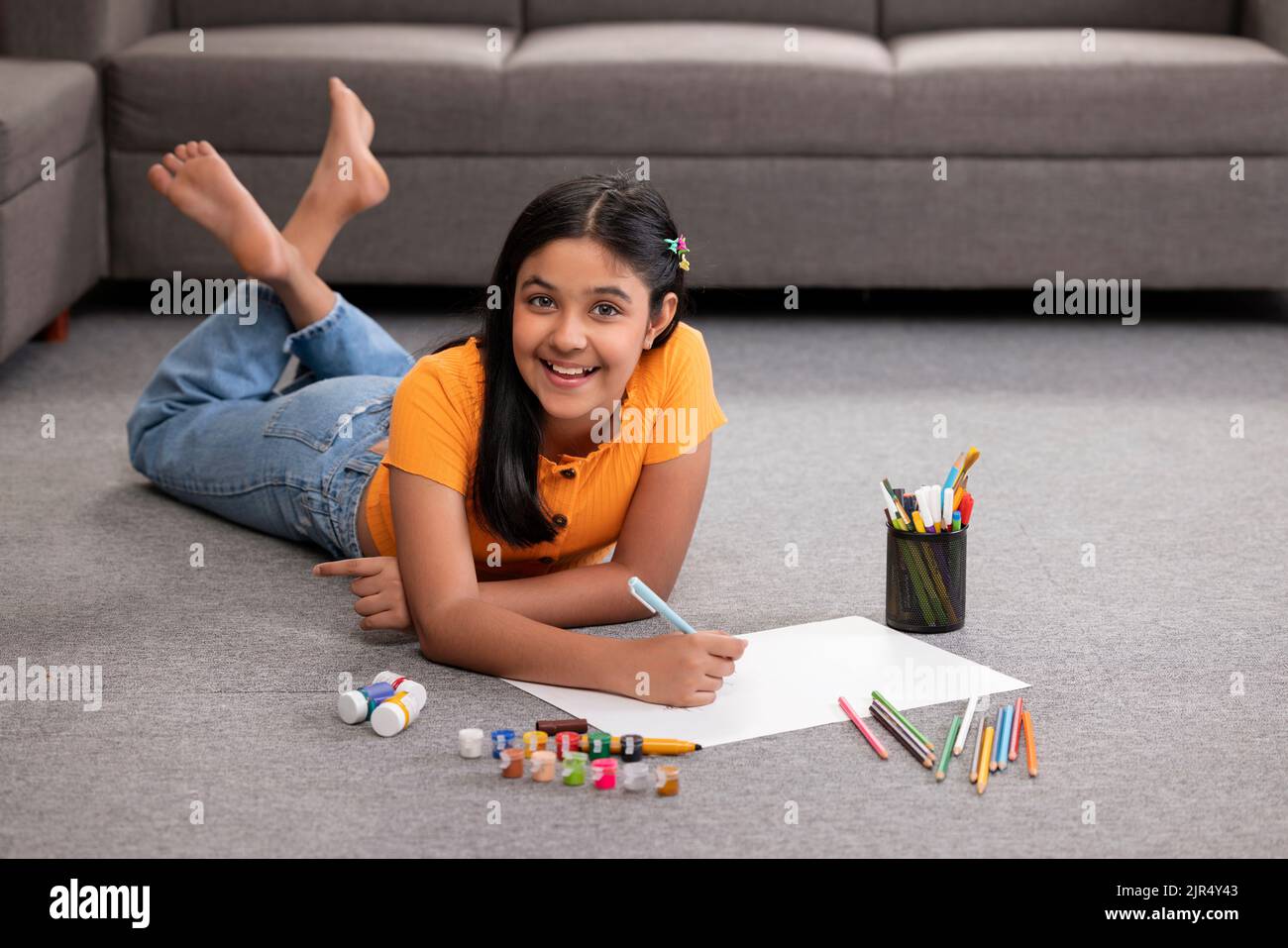 Child lying on floor drawing hi-res stock photography and images - Alamy