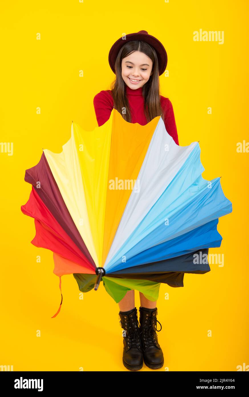 Happy teenager portrait. Child teenager girl with umbrella on yellow ...