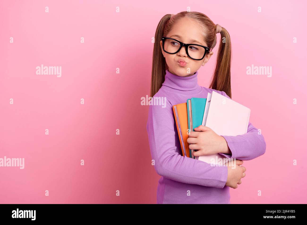 Photo of young pretty little schoolgirl go to lesson class look empty space brainstorming ...