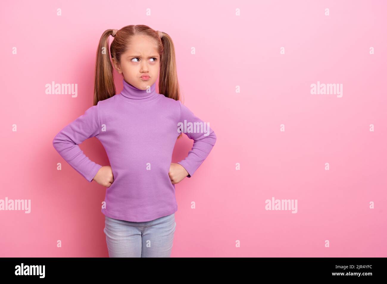 Photo of young pretty little girl with funny grimace face look empty ...