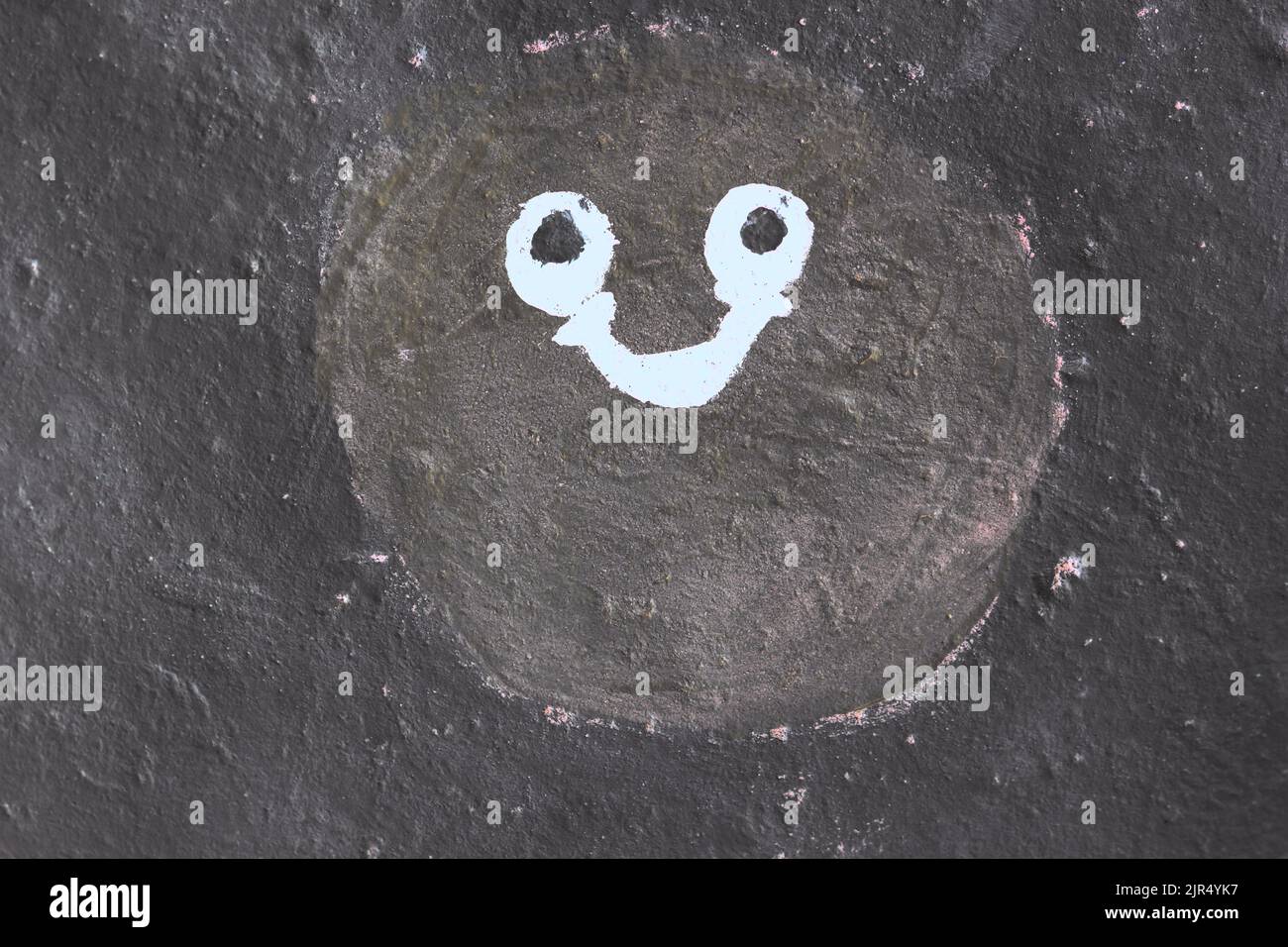 Cute smiley face grinning back at me in black and white monochrome film ...
