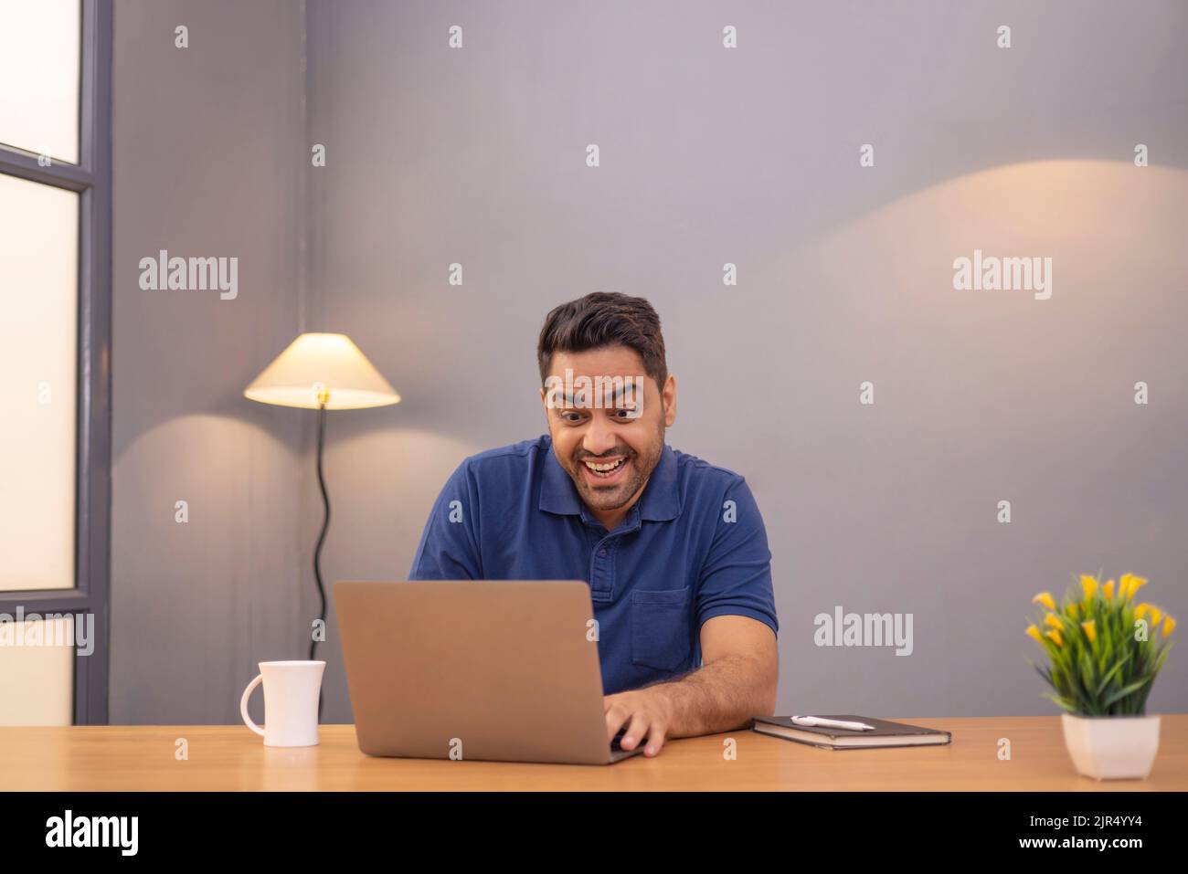 Smiling young freelancer book hi-res stock photography and images - Alamy