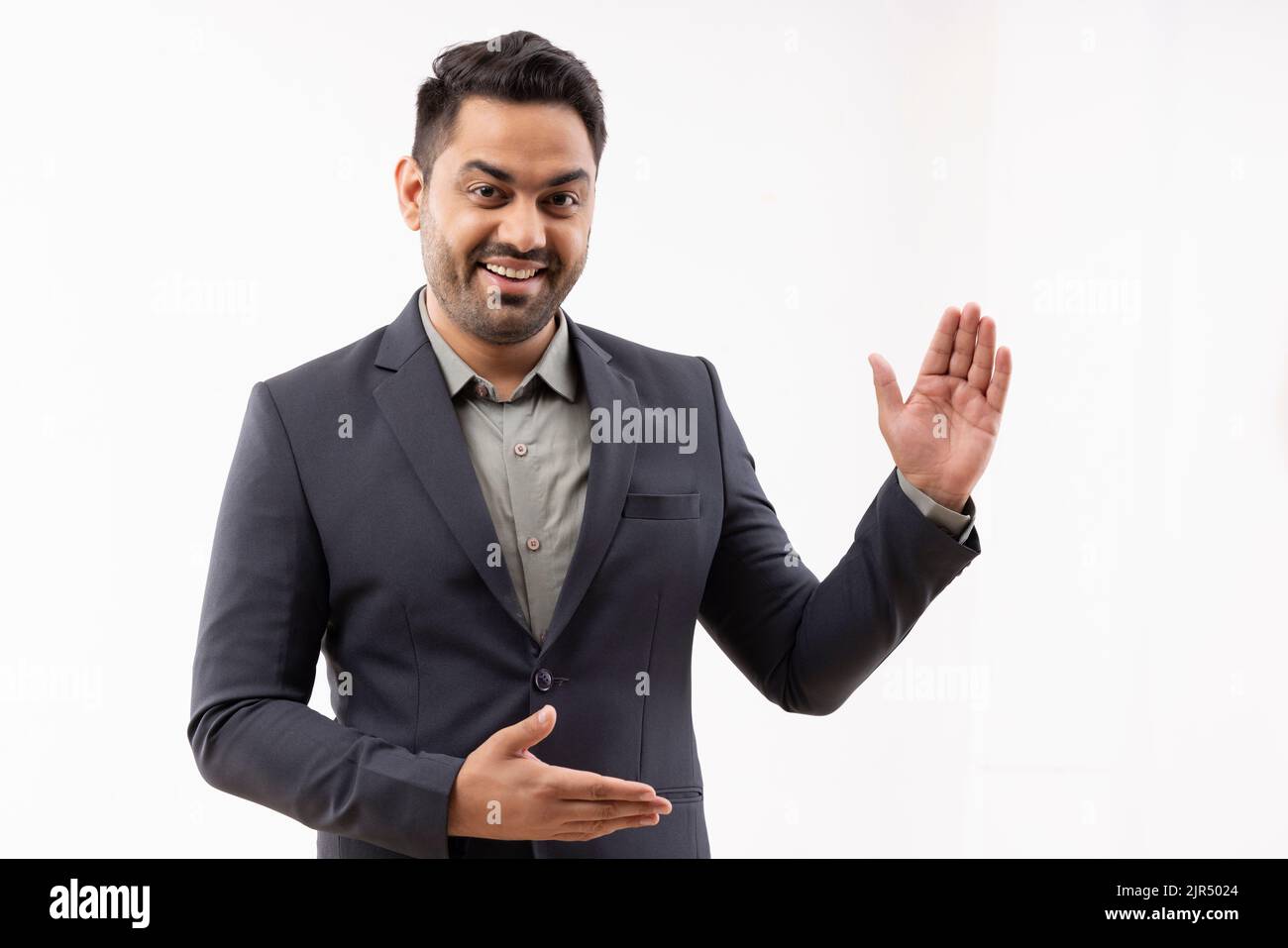 Young businessman in formal outfit gesture hi-res stock photography and ...