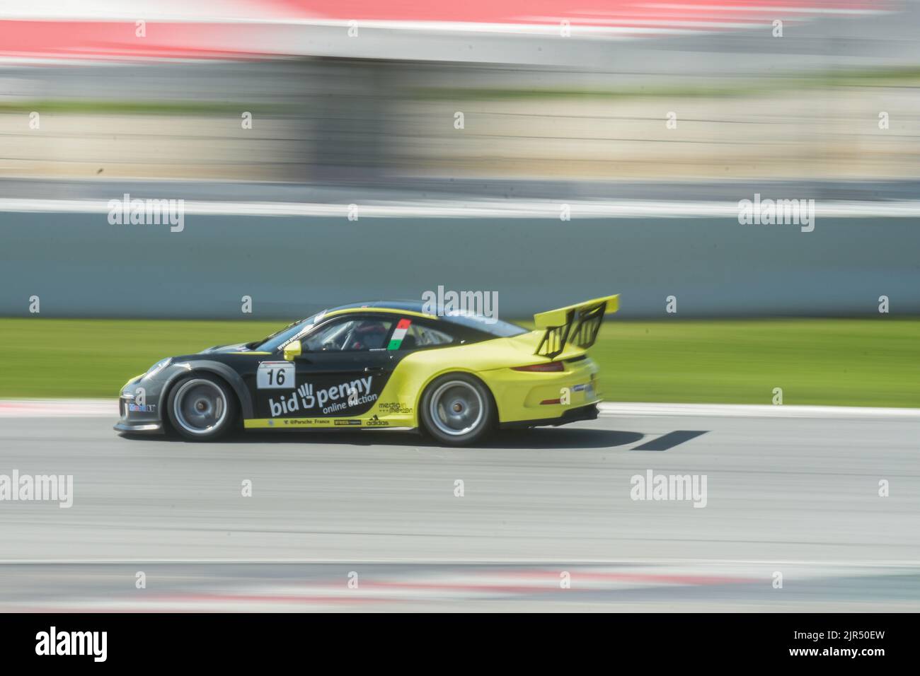 A modern Germany fast car Porsche 911 driving in track Stock Photo - Alamy