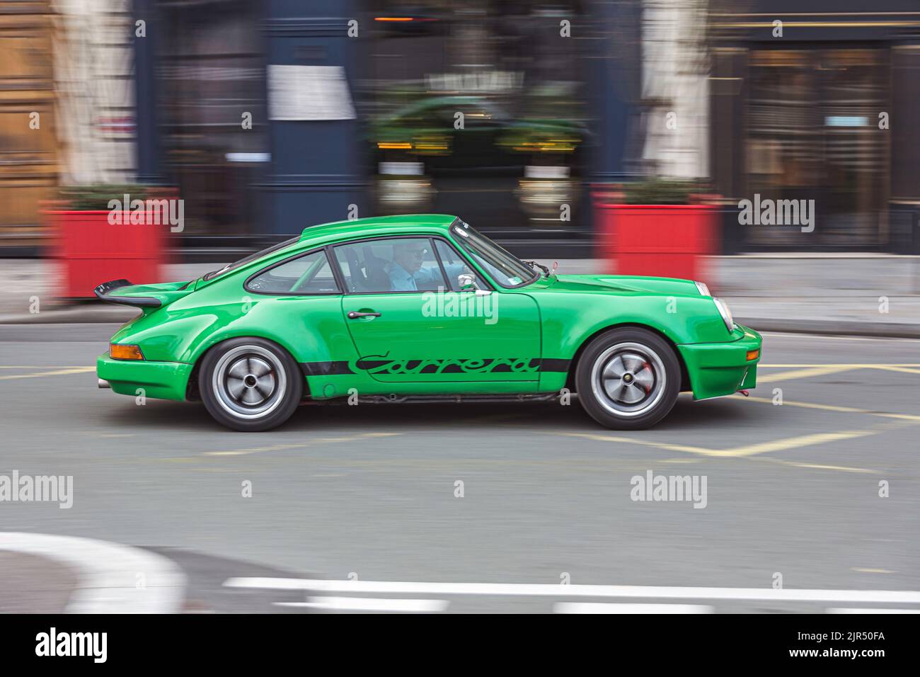 A modern Germany green Porsche 911 sport car in the street Stock Photo ...
