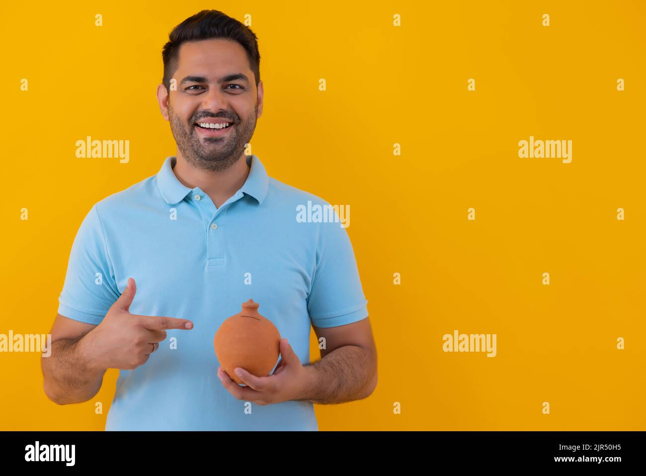 Hand money pot hi-res stock photography and images - Alamy
