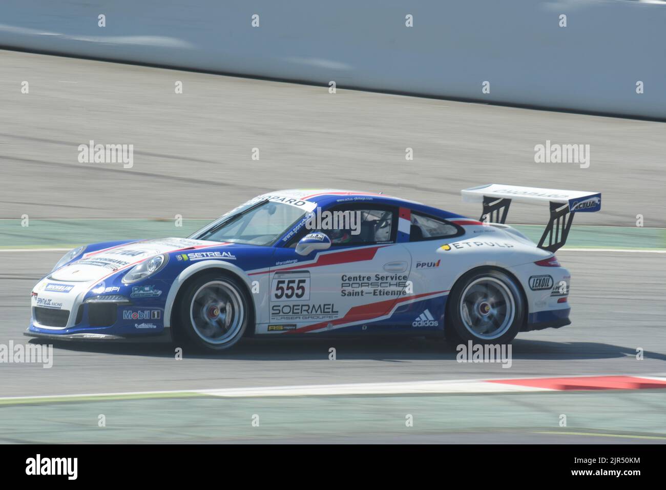 A modern Germany fast car Porsche 911 driving in track Stock Photo - Alamy