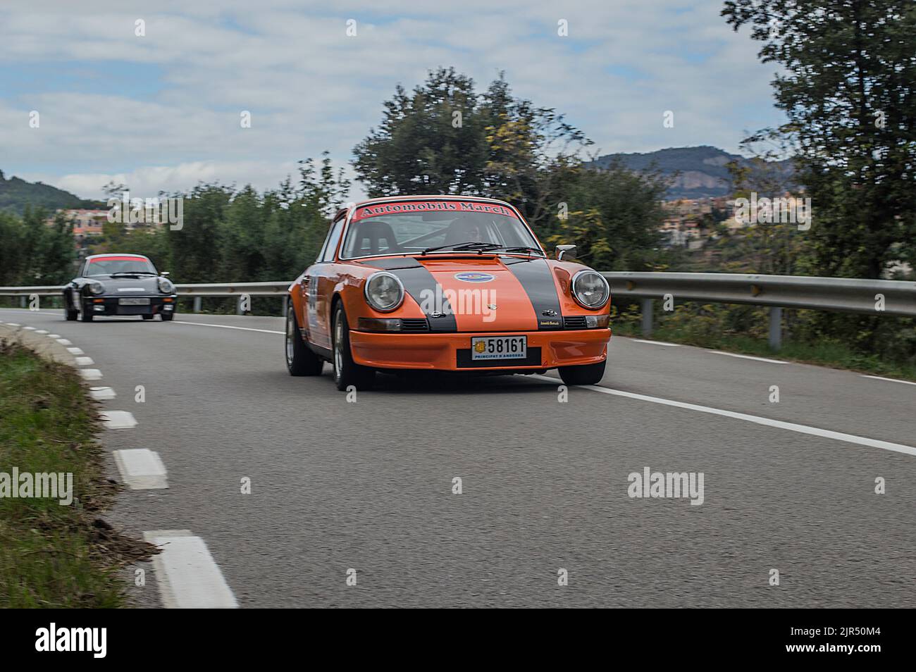 A modern Germany fast car Porsche 911 driving in race Stock Photo - Alamy