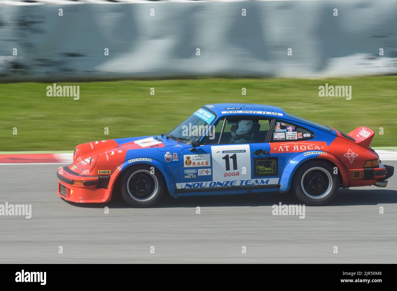 A modern Germany fast car Porsche 911 driving in track Stock Photo - Alamy