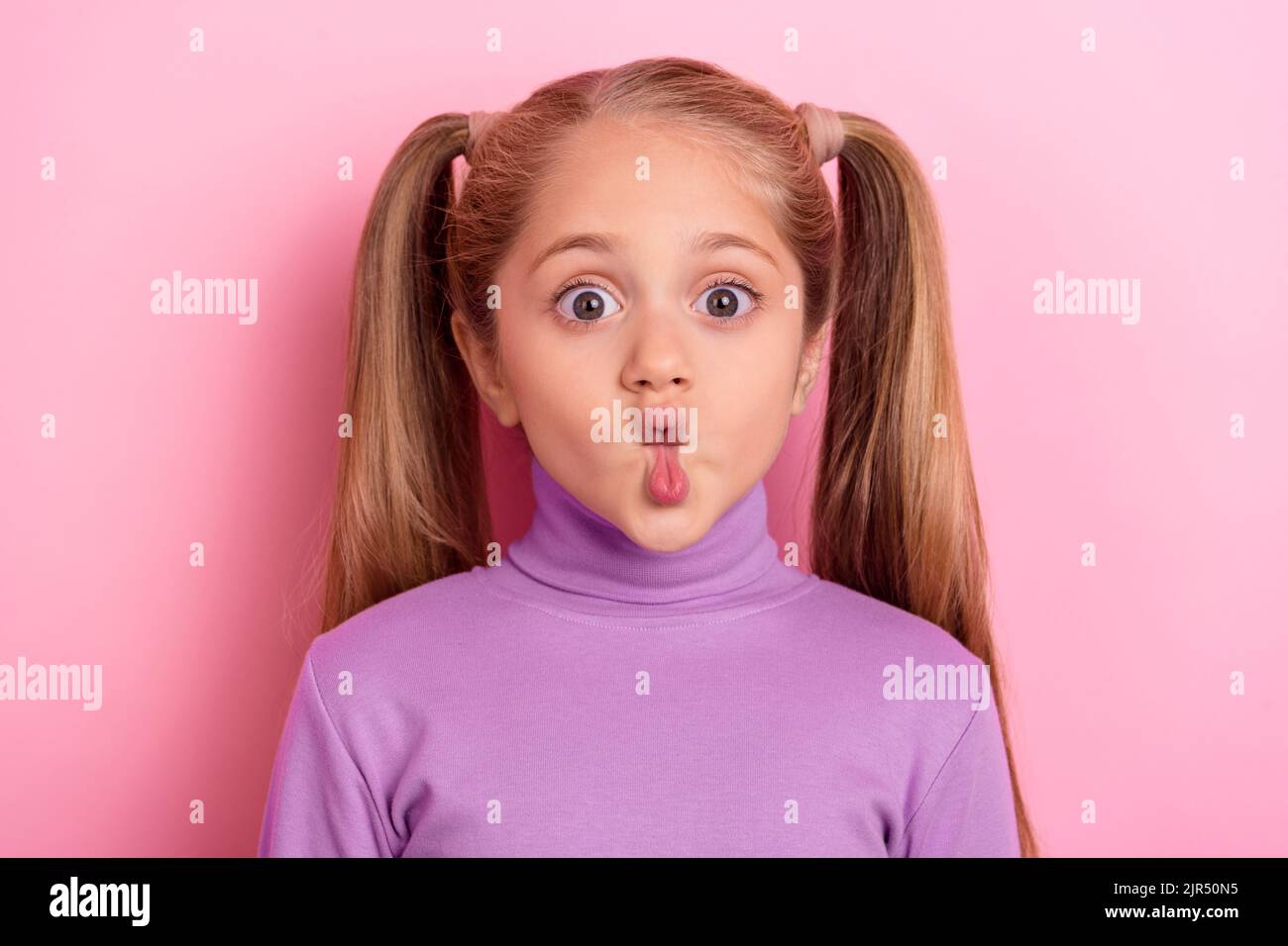 Photo of young adorable cute little girl make hilarious silly faces ...