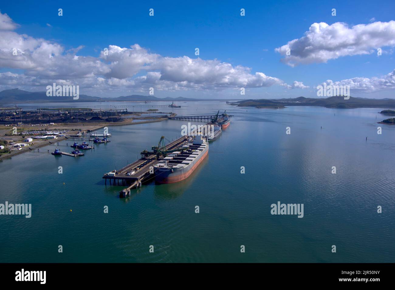 Aerial of coal being exported from RG Tanna Coal Terminal onto waiting ...