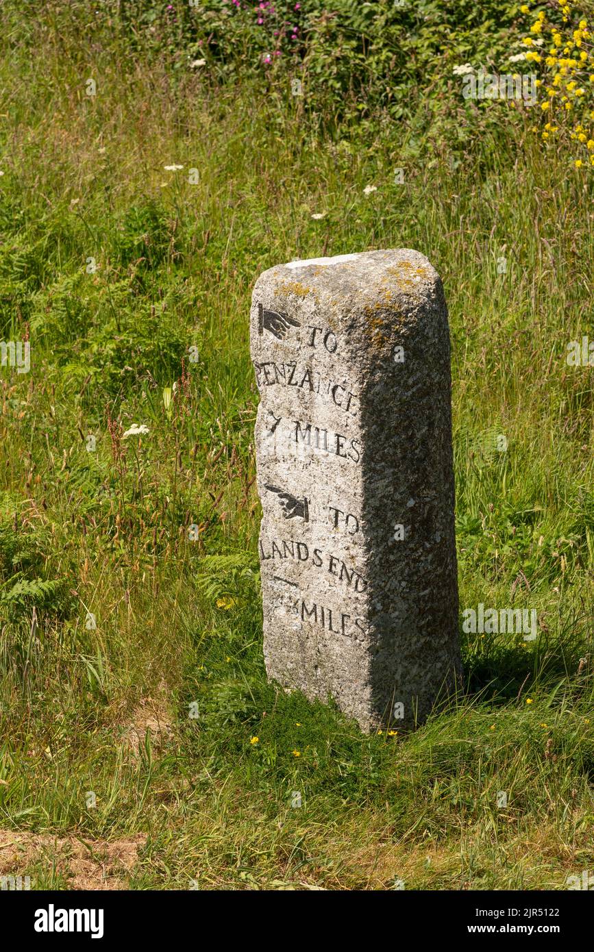 Cornwall, England, UK. 2022. An old milestone on the roadside pointing ...