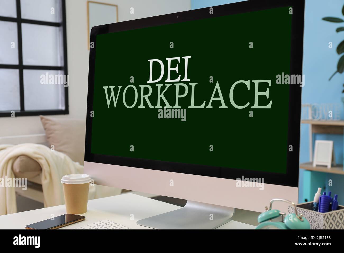 Computer monitor with text DE and I (diversity, equity, inclusion ...