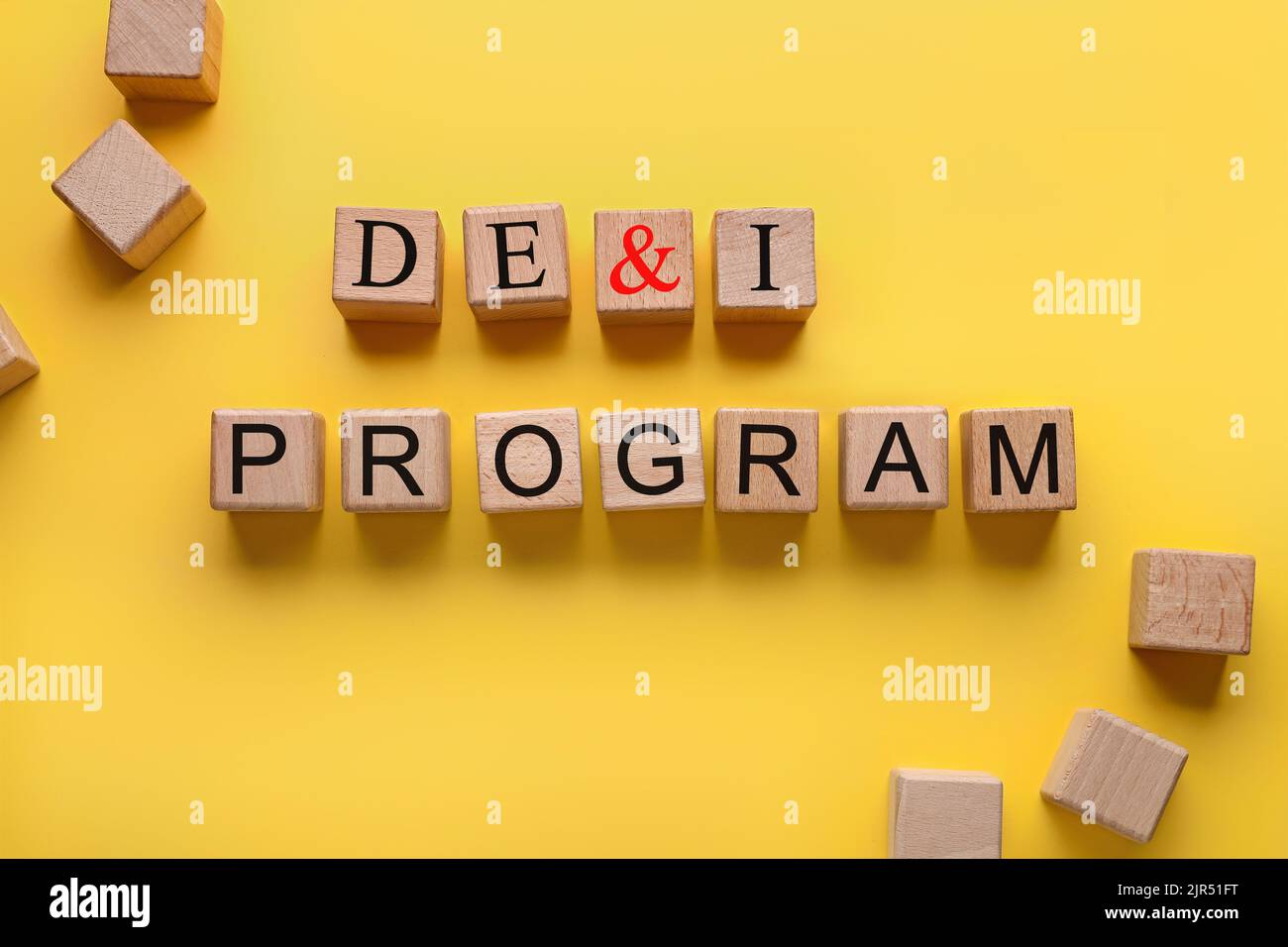 Wooden cubes with text DE and I (diversity, equity, inclusion) program ...