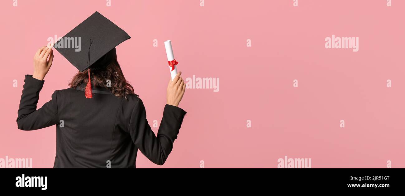 Female graduating student with diploma on pink background with space ...