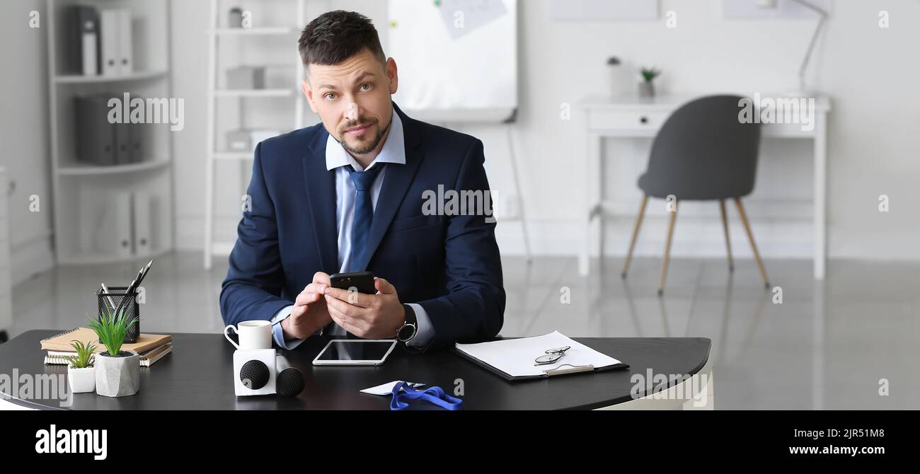Male journalist working in office Stock Photo - Alamy