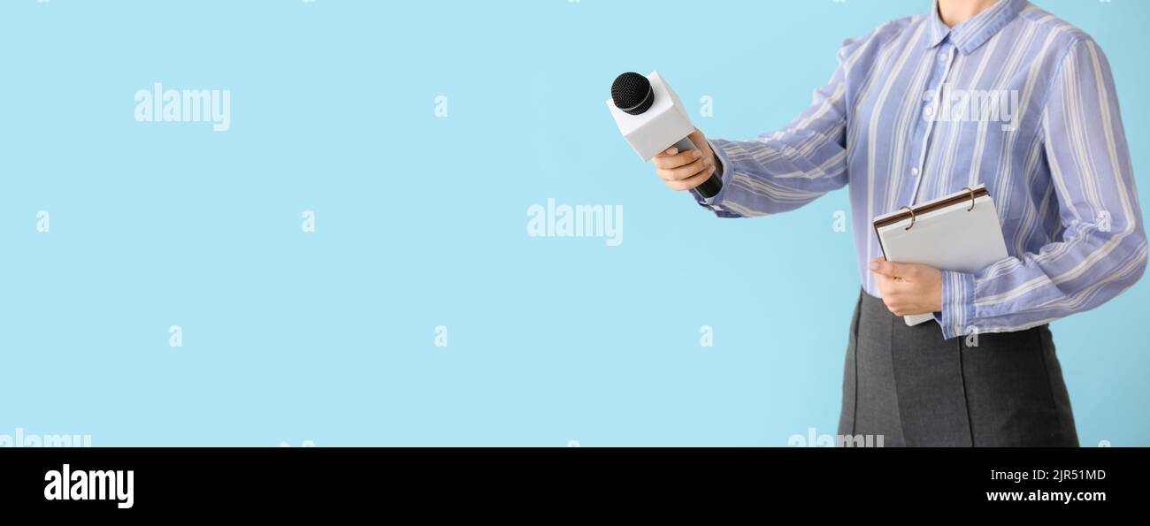 Journalist with microphone on light blue background with space for text ...