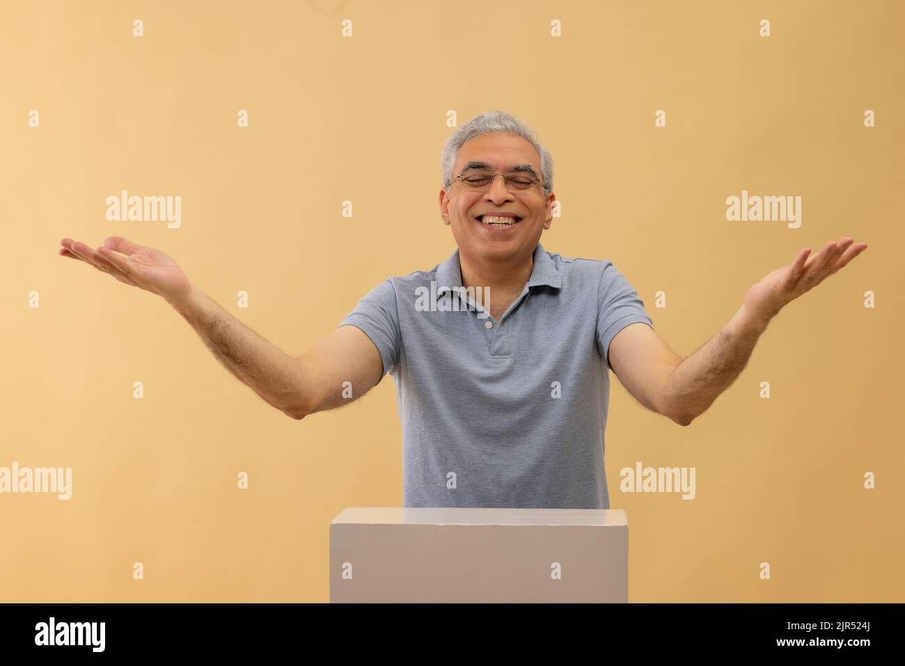 Happy senior man in casual outfit smiling with arms outstretched and ...