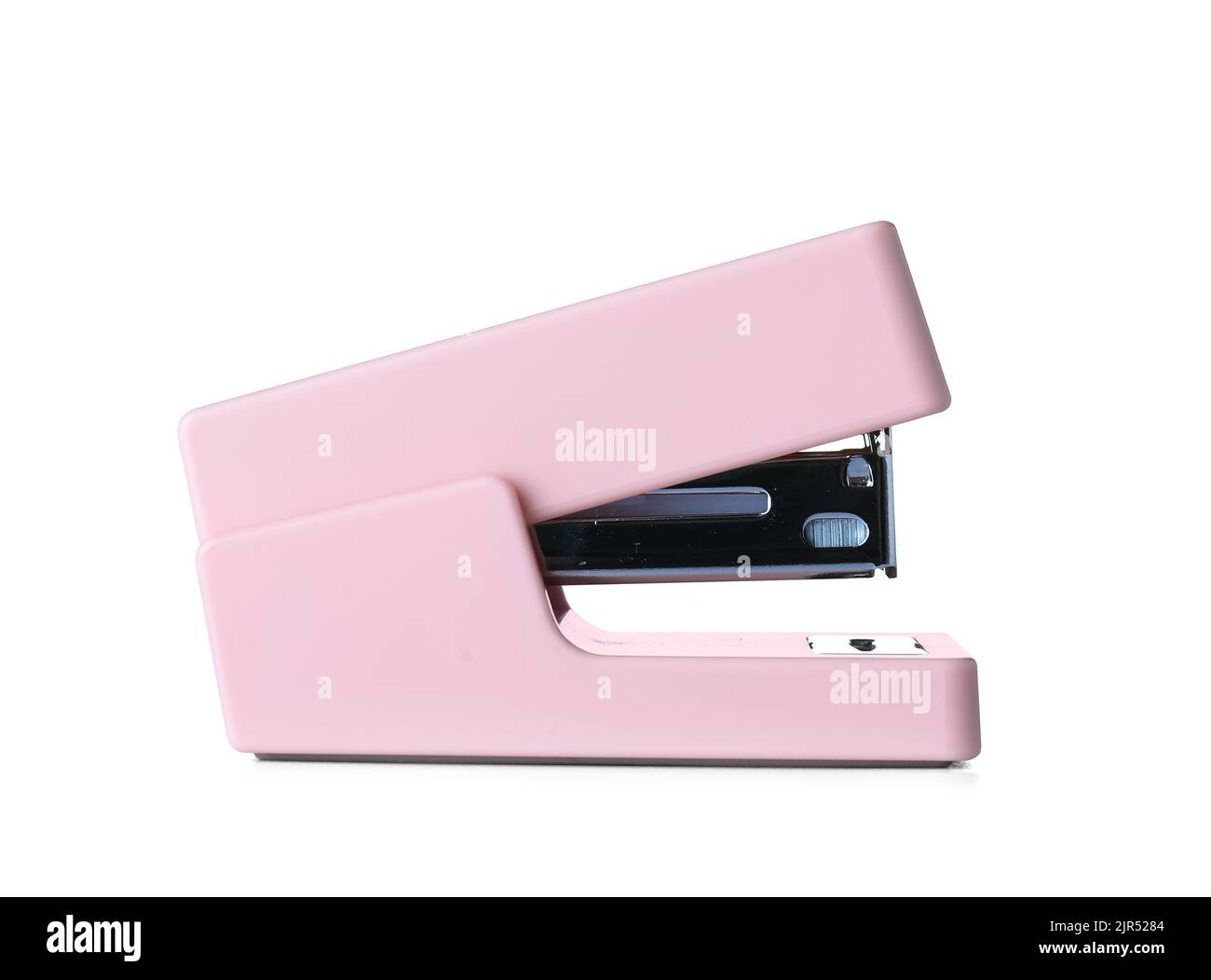 Modern pink stapler on white background Stock Photo - Alamy