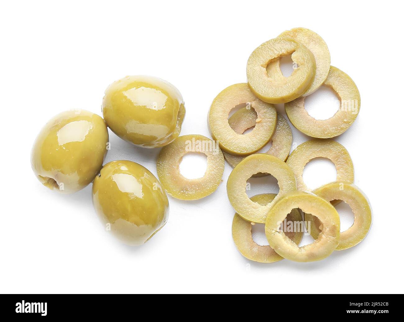 Whole and cut green olives on white background Stock Photo - Alamy
