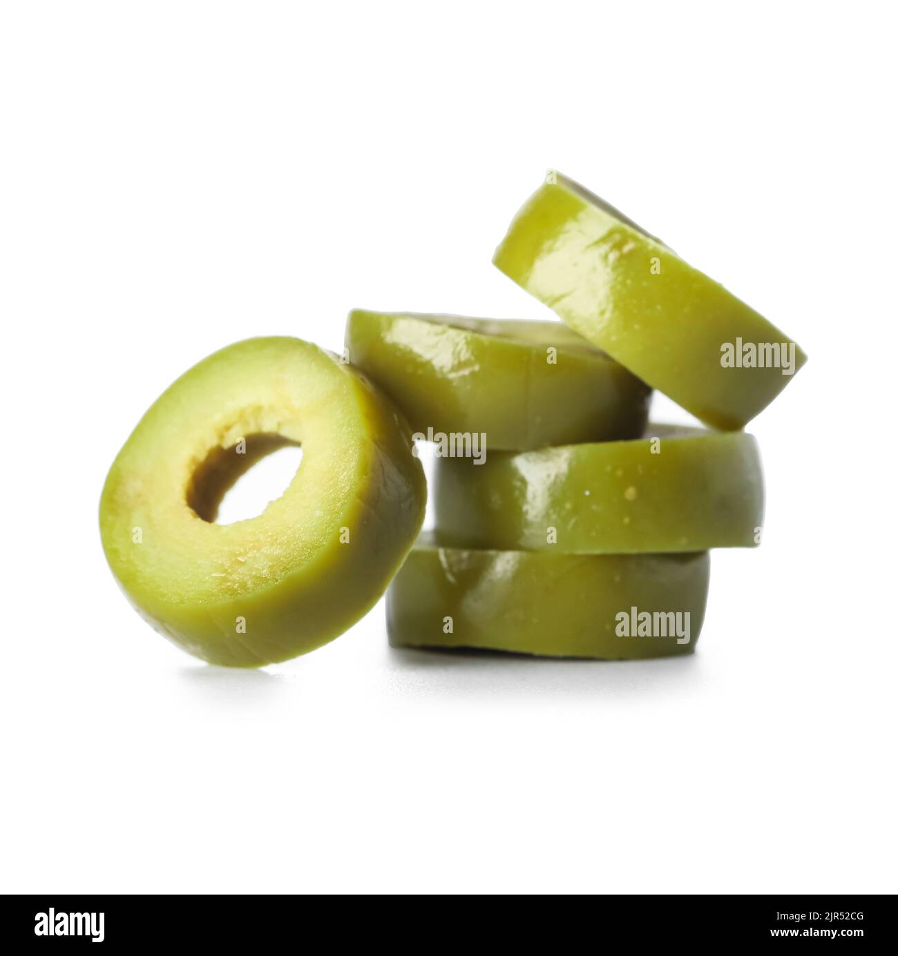 Stack of cut green olives on white background Stock Photo - Alamy