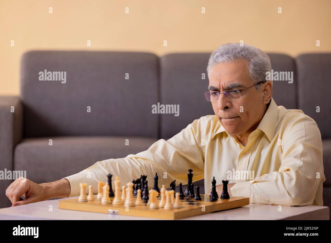 Indian man playing chess hi-res stock photography and images - Alamy