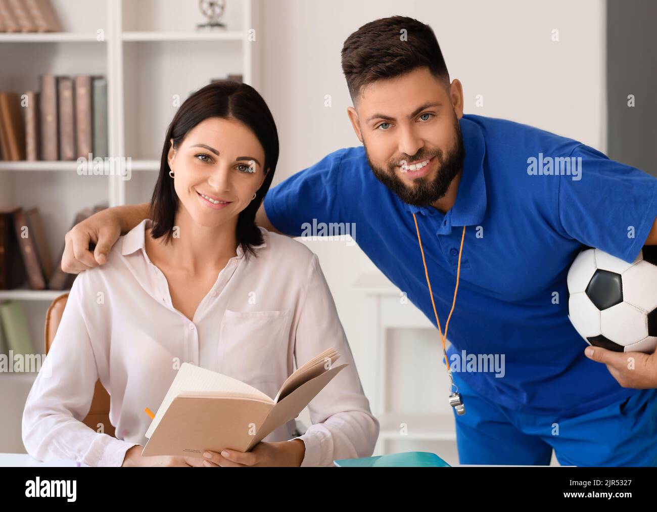 Teachers working in school office Stock Photo - Alamy