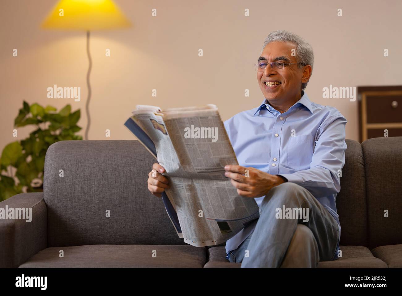 Indian man home newspaper reading hi-res stock photography and images ...