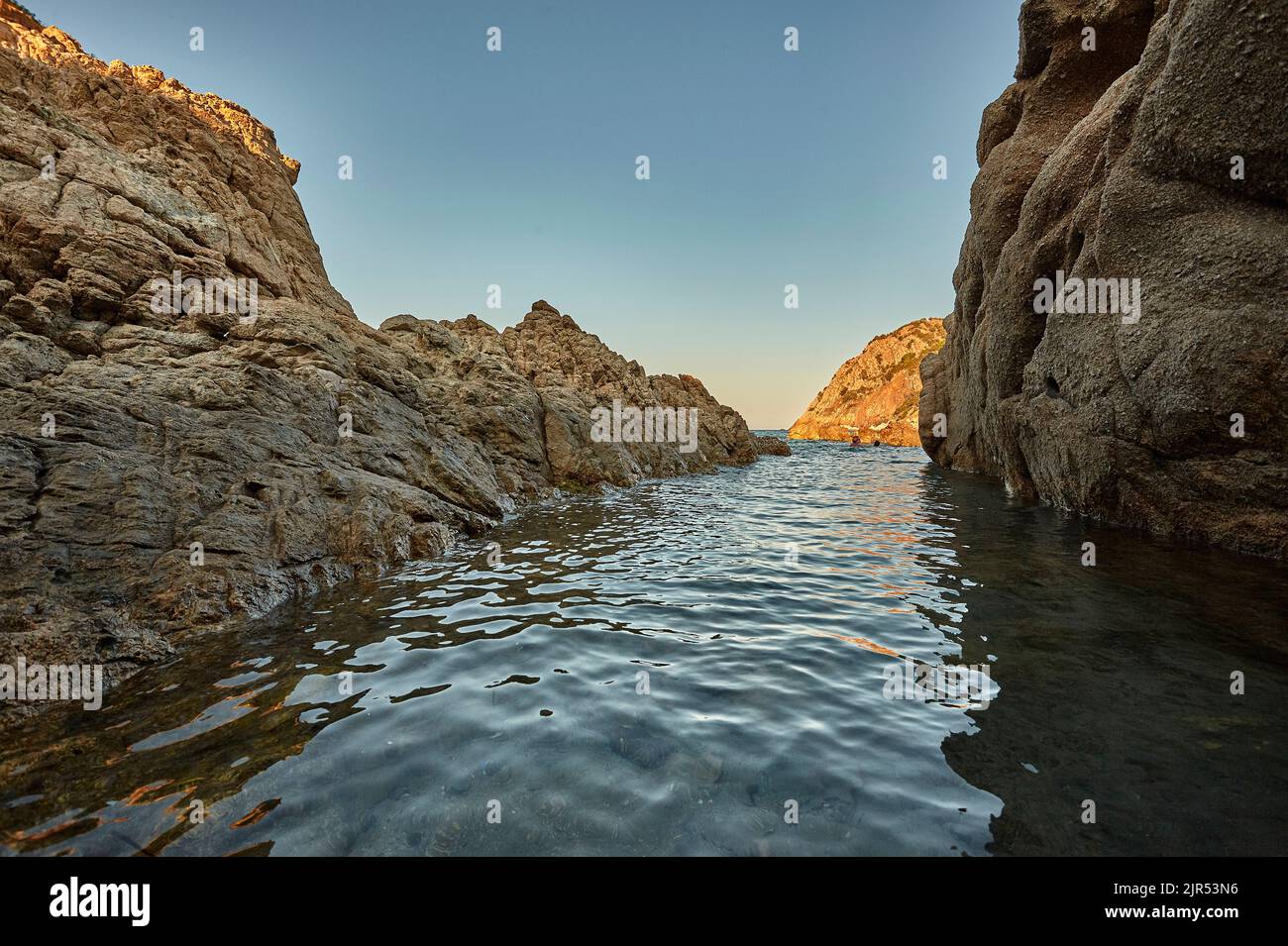 View from the water of a pair of sea cliffs typical of the south coast ...