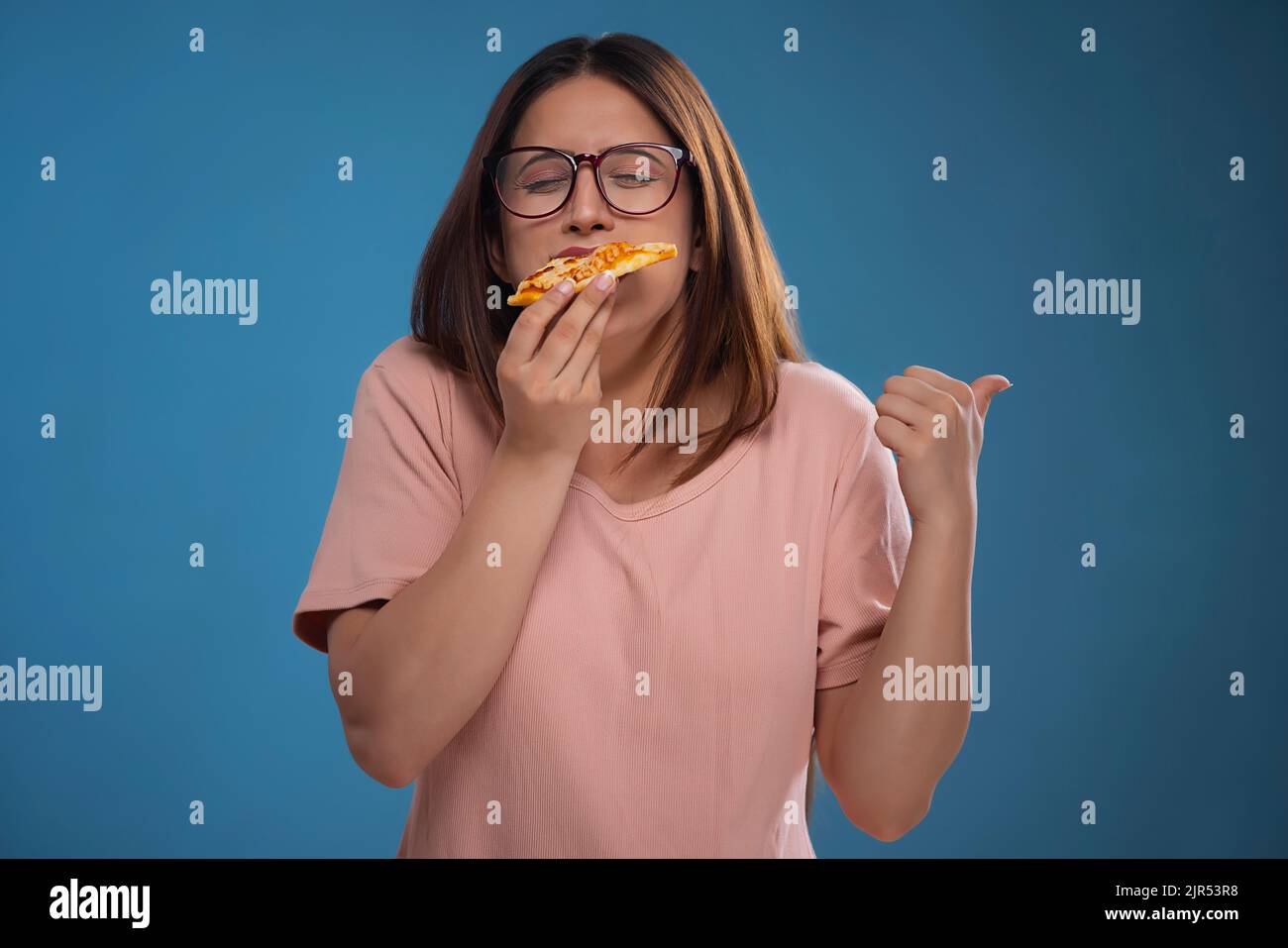 Indian woman eating pizza hi-res stock photography and images - Alamy