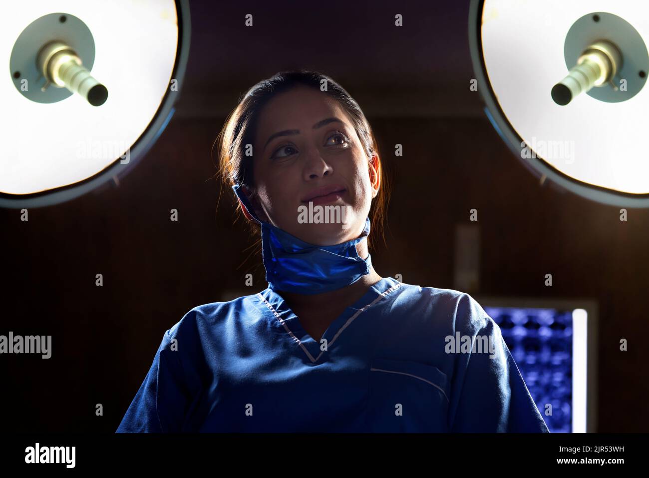 Portrait of young female nurse after surgery in operating theatre Stock ...