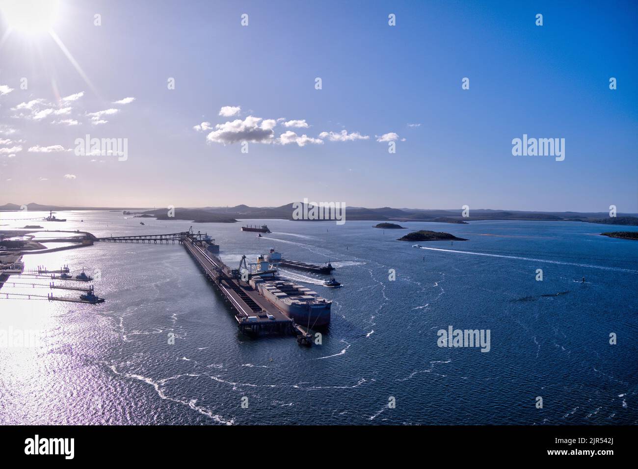 Aerial of bulk carrier departing with load of export coal for the ...