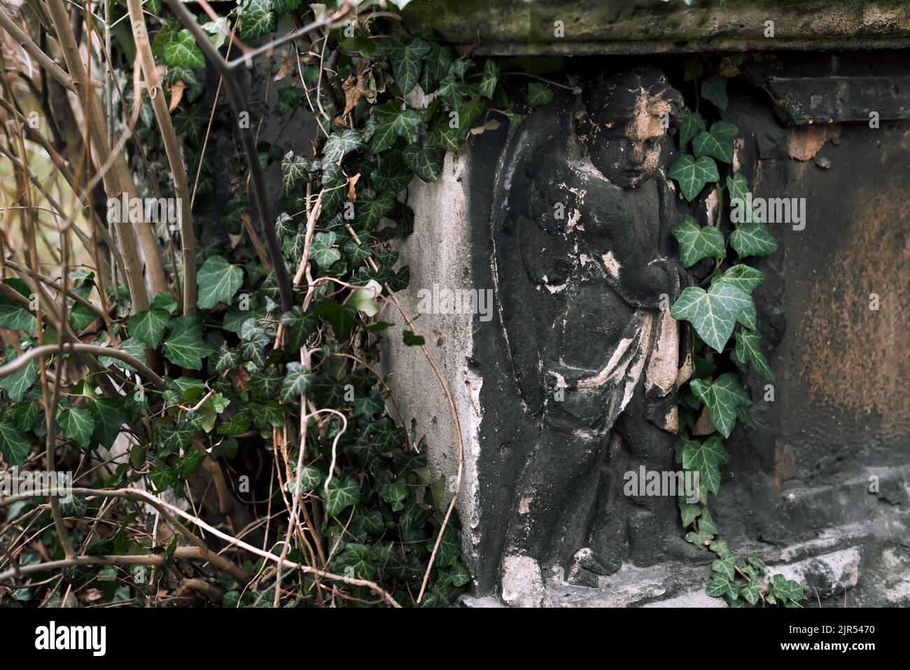 Abandoned Tomb with Creepy Cherub Angel Stock Photo - Alamy
