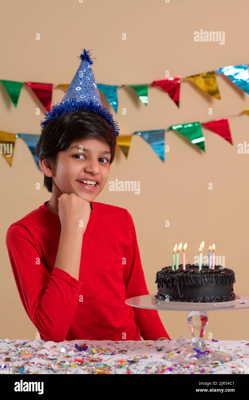 Portrait of happy boy celebrating his birthday Stock Photo - Alamy